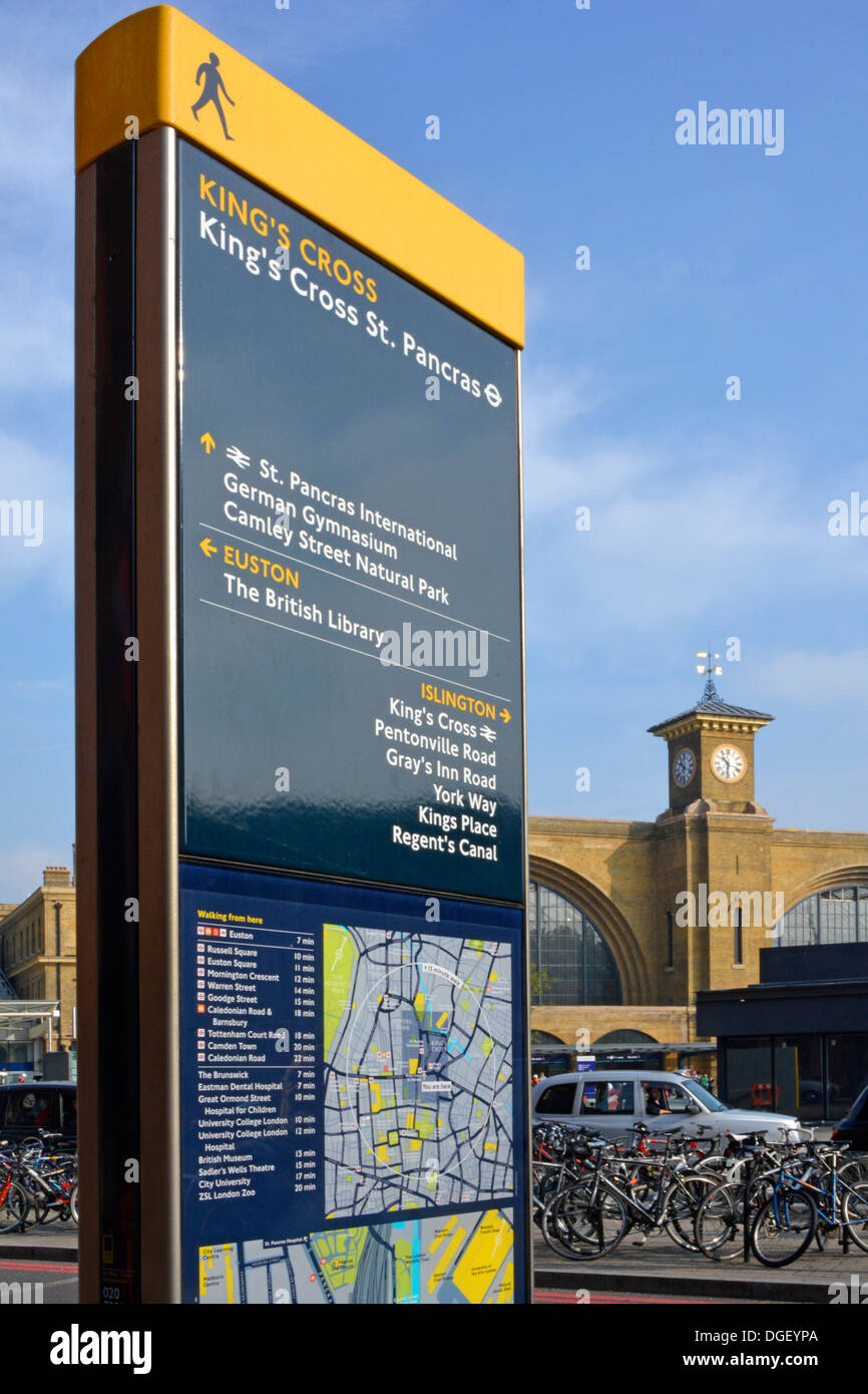 Legible London street sign with refurbished Kings Cross station facade ...