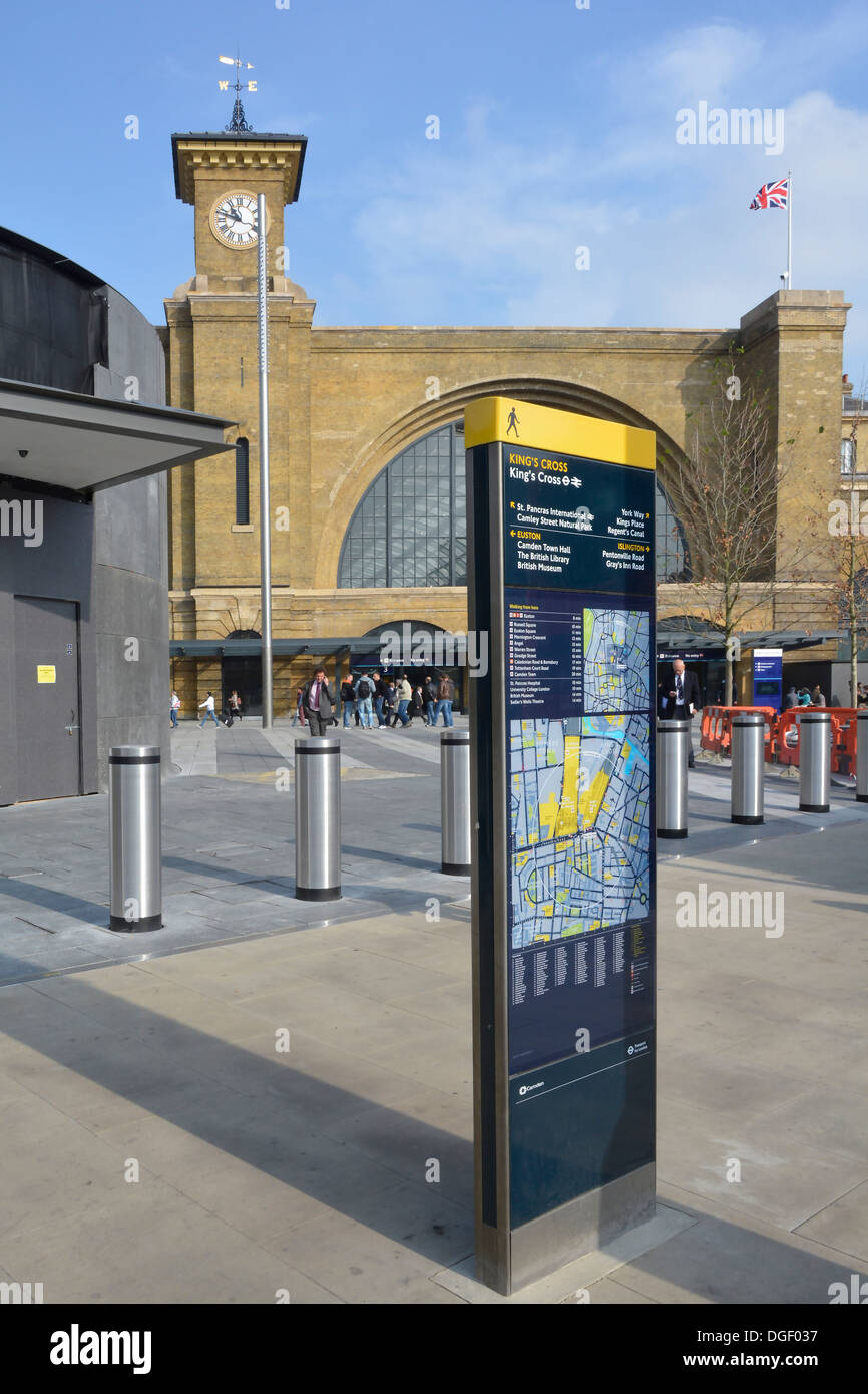 Legible London street sign with refurbished Kings Cross station facade ...