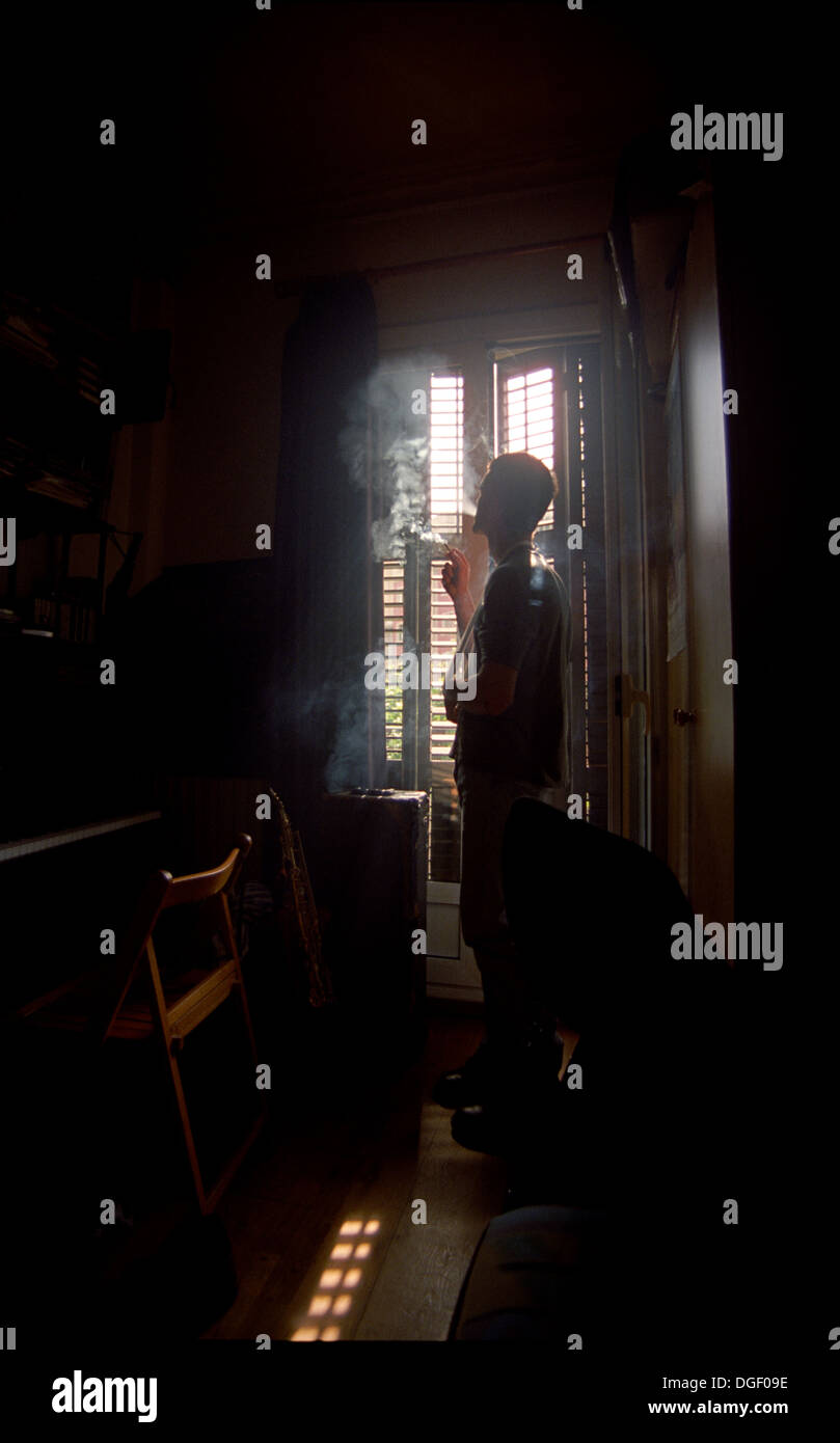 The smoker at the window hi-res stock photography and images - Alamy
