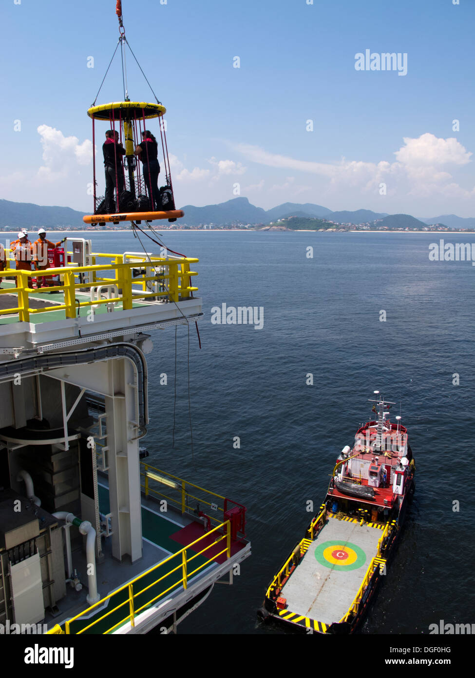 crew members of oil rig been transported on a basket to a Stock Photo ...