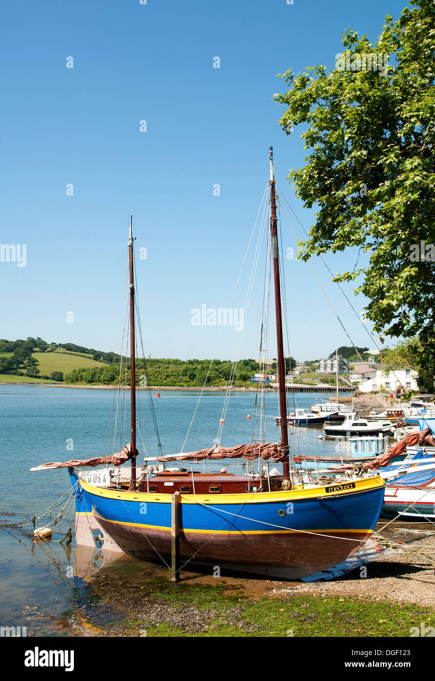 small boats moored at sunny corner on the river fal near truro in ...