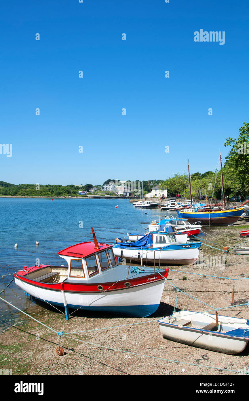 small boats moored at sunny corner on the river fal near truro in ...