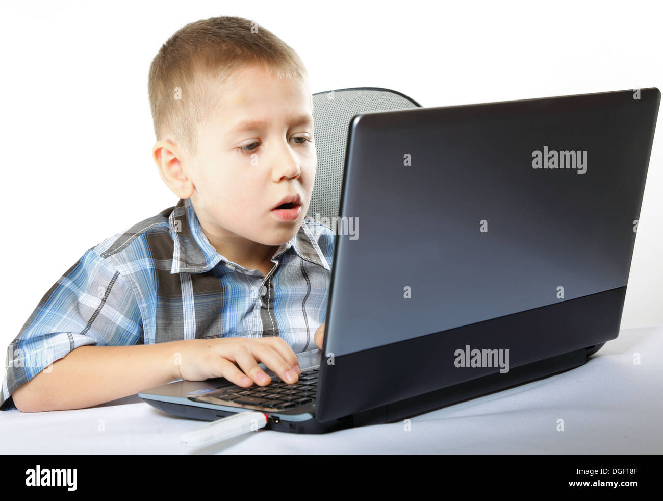Computer addiction child boy with laptop notebook white background ...