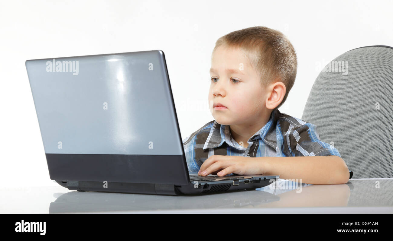 Computer addiction child boy with laptop notebook white background ...