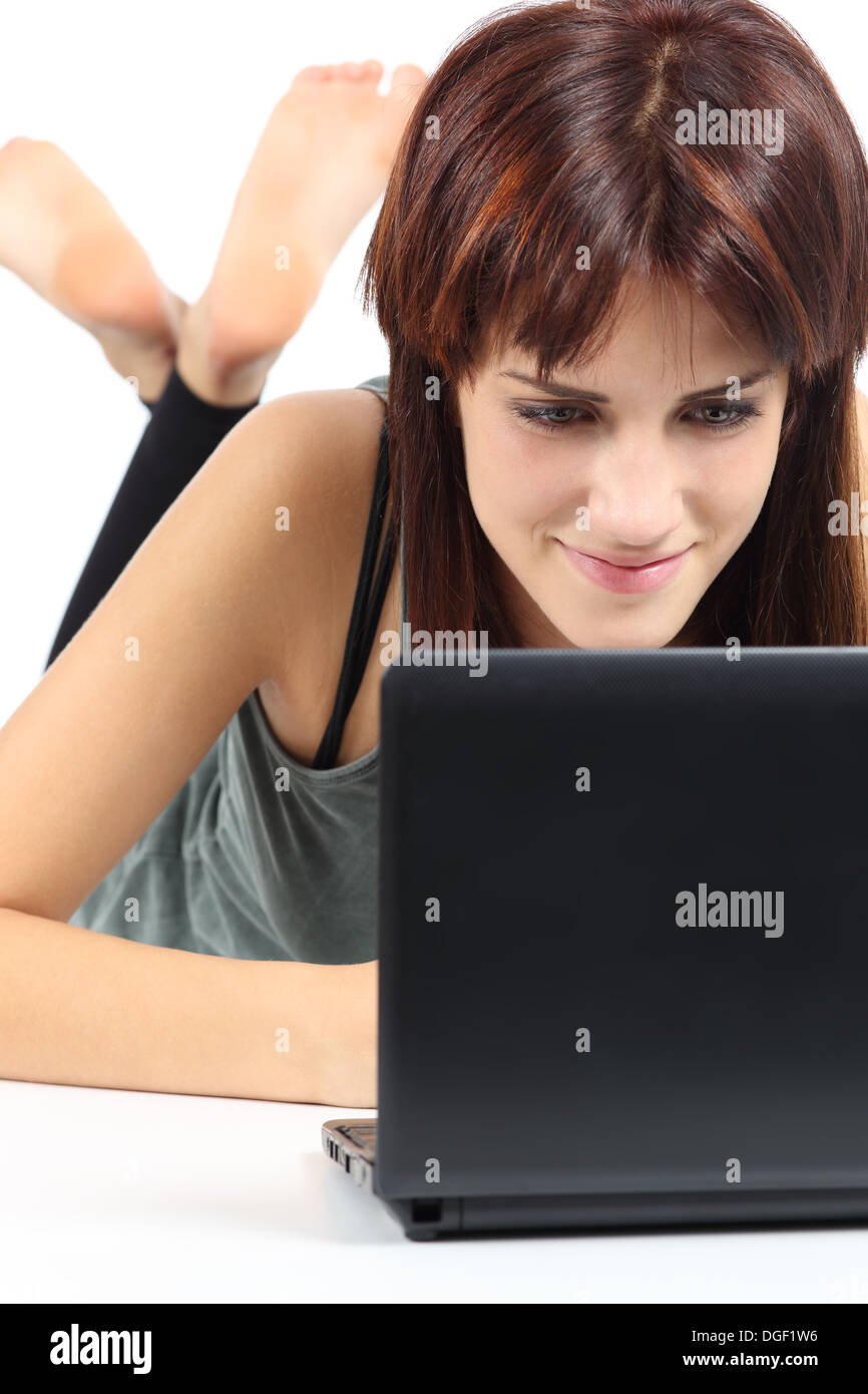 Beautiful woman lying and watching a netbook computer isolated on a ...