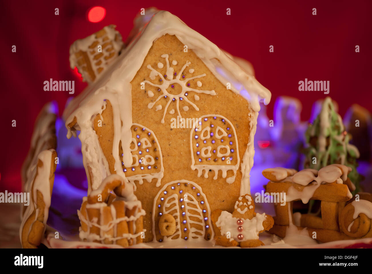 Gingerbread house for Christmas in red background Stock Photo - Alamy