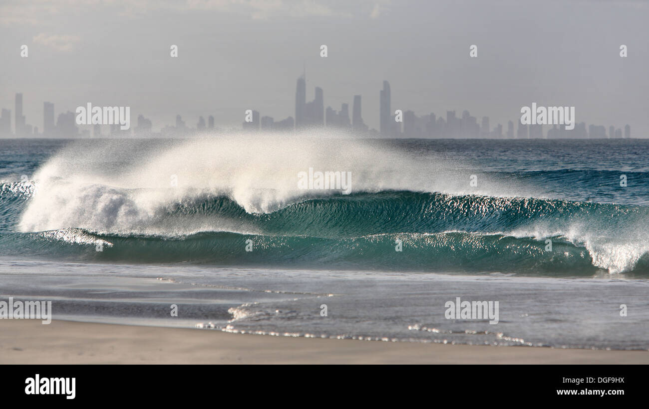 Rolling surf with Surfers Paradise skyline in the background. Gold ...