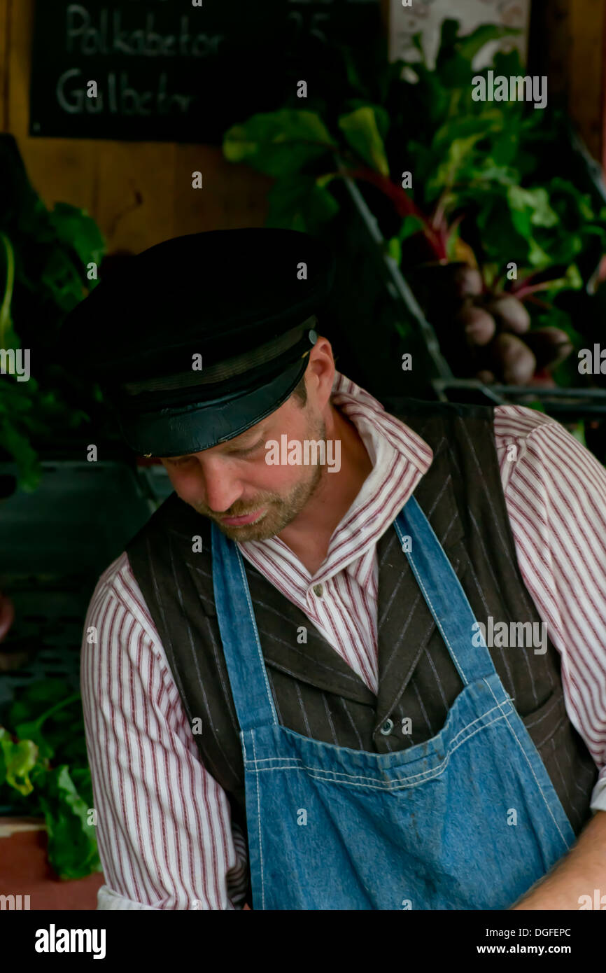 Salesman selling vegetables at the market, Sweden Stock Photo - Alamy