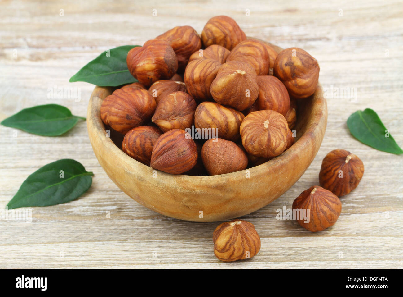 Whole hazelnuts without shell in wooden bowl Stock Photo - Alamy