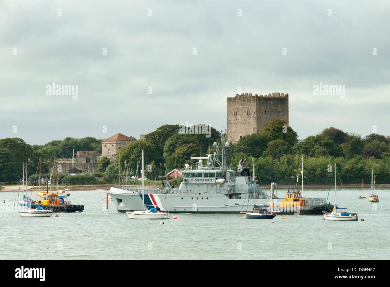 UK border force ship being towed in Portsmouth Harbour after refit ...