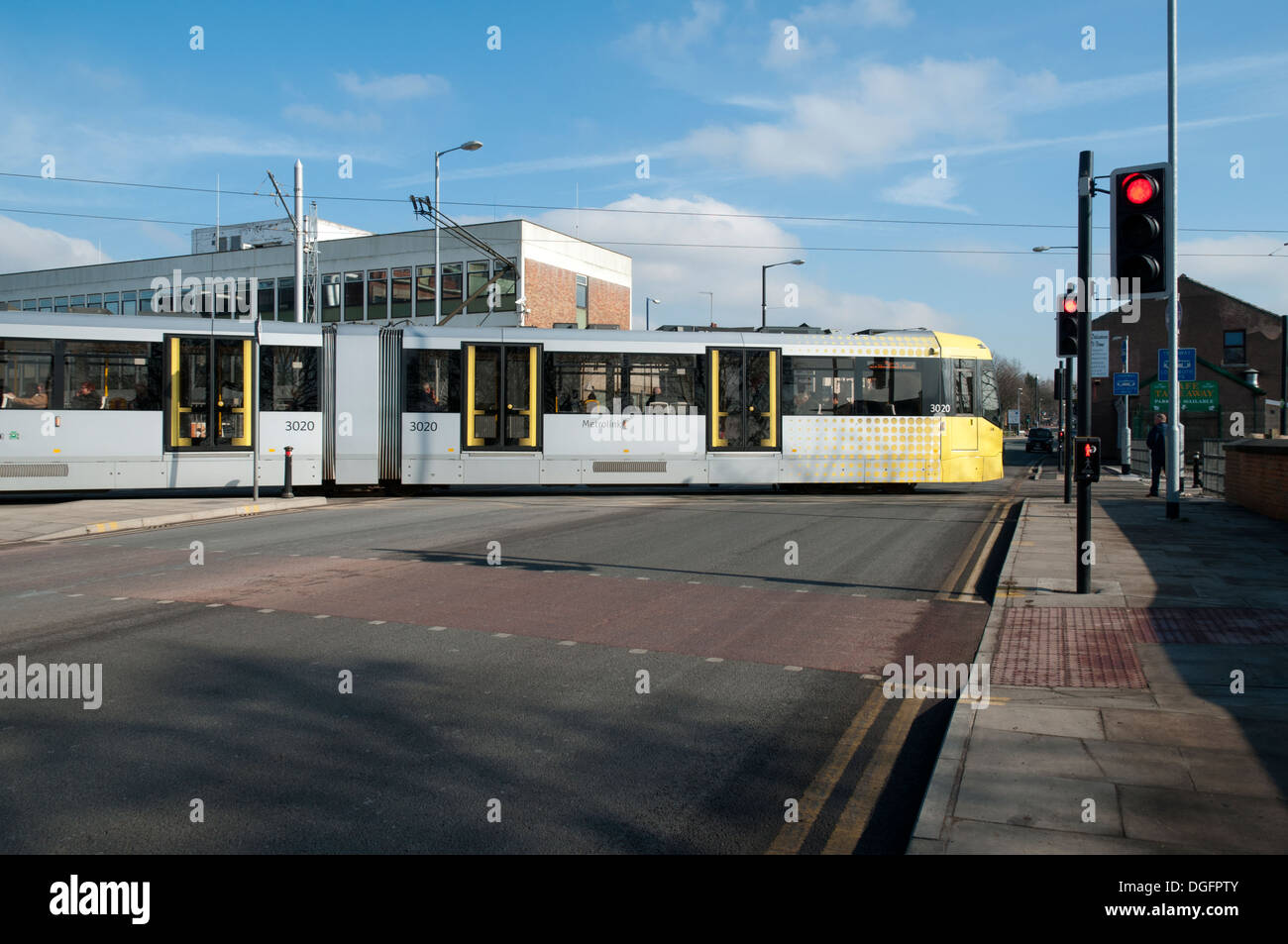 Metrolink tram on the East Manchester Line, crossing Ashton New Road ...