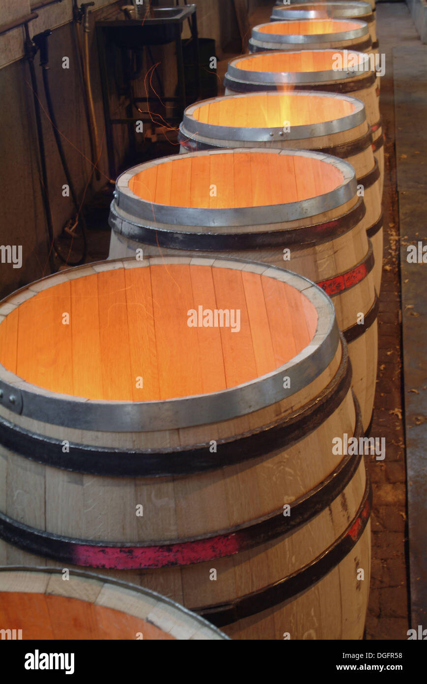 Burning the interior of oak casks at casks factory Stock Photo - Alamy