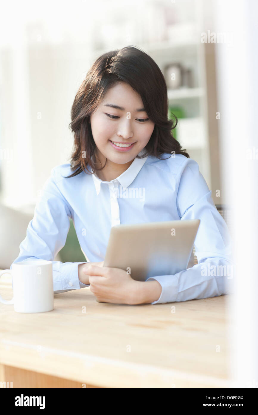 Back view woman tablet hi-res stock photography and images - Alamy
