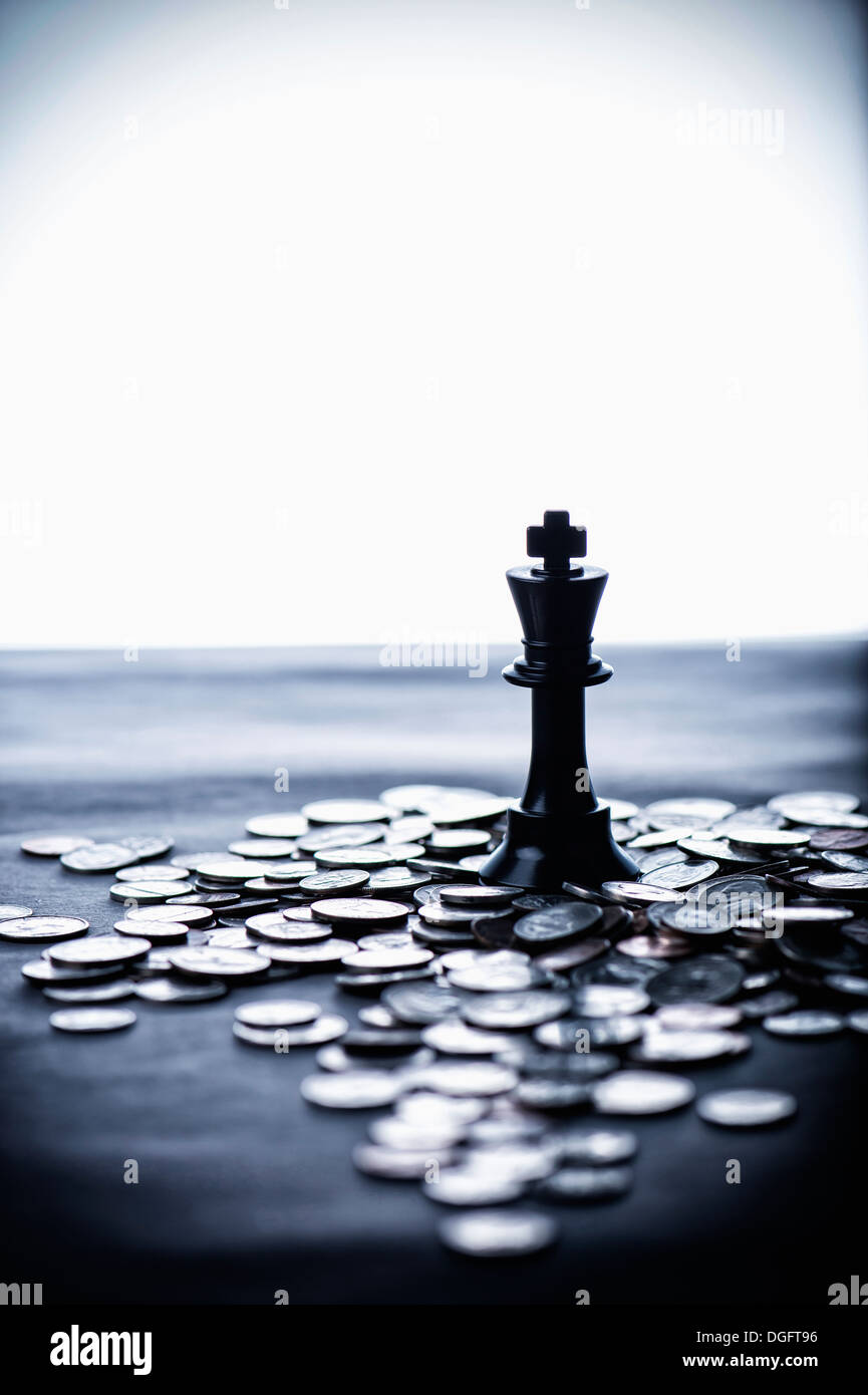 a tower standing on a pile of coins Stock Photo - Alamy