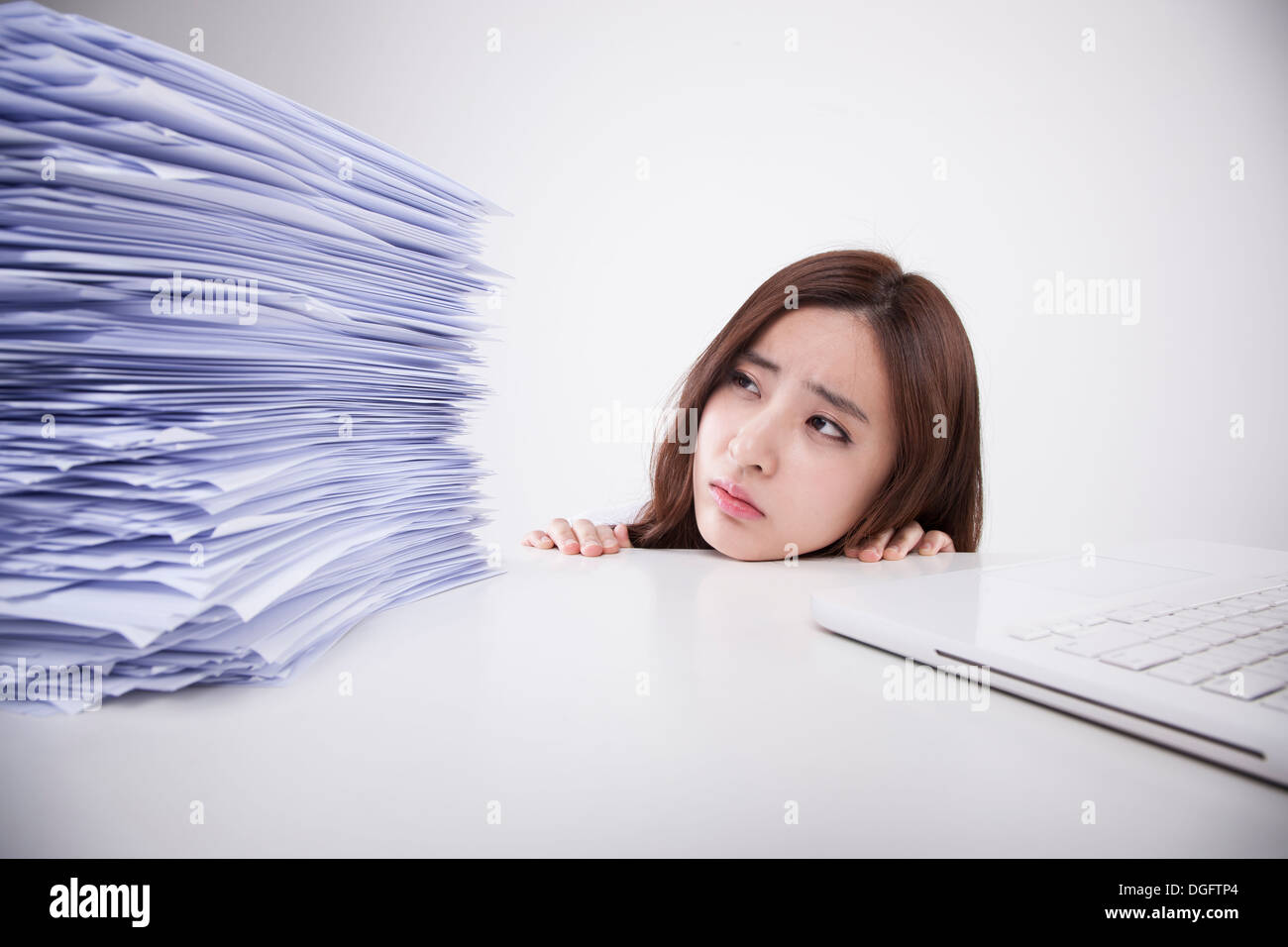 a business woman with a big pile of work Stock Photo - Alamy