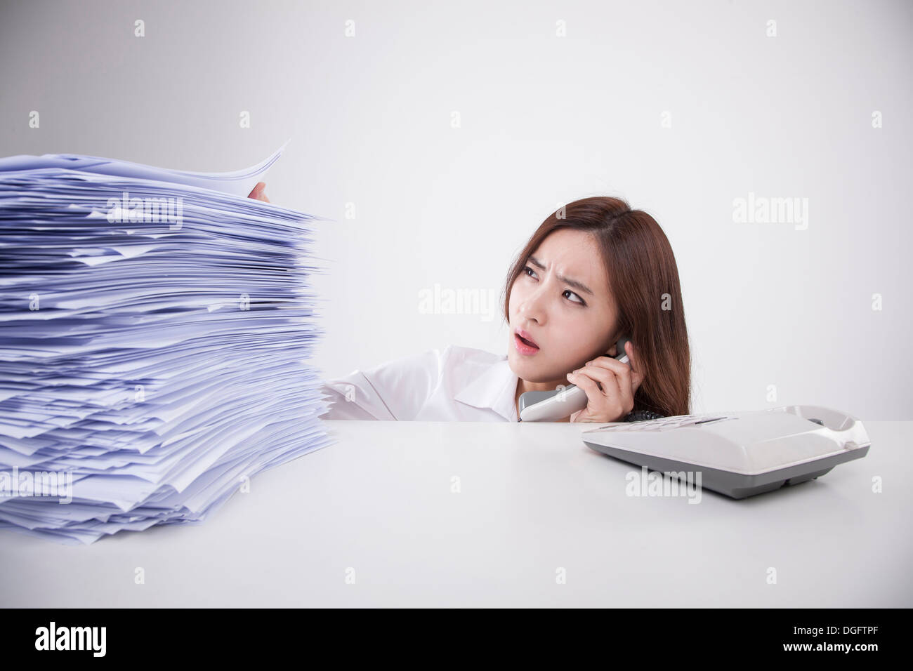a business woman with a big pile of work Stock Photo - Alamy