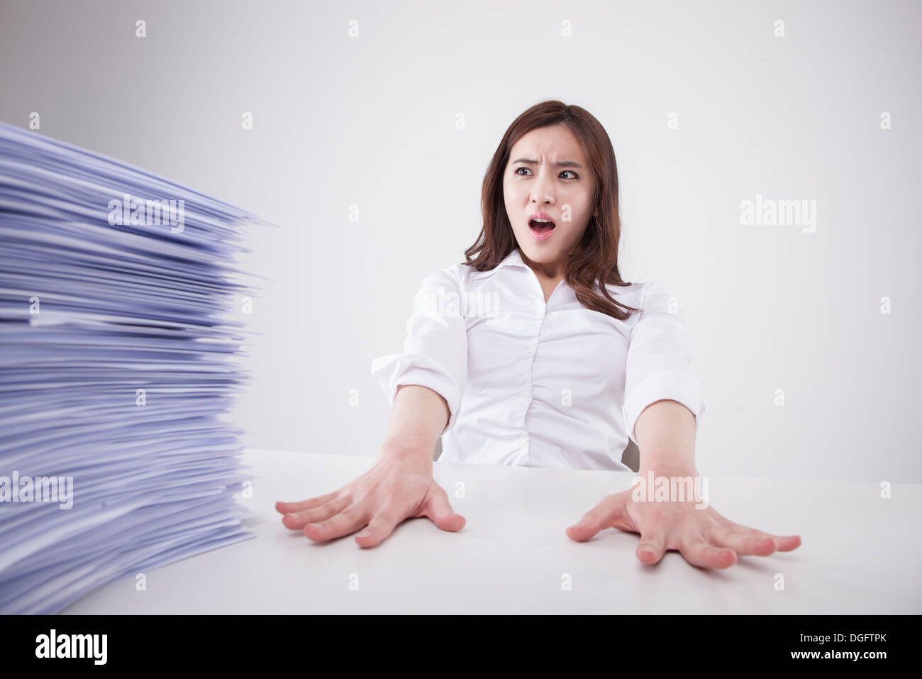 a business woman with a big pile of work Stock Photo - Alamy