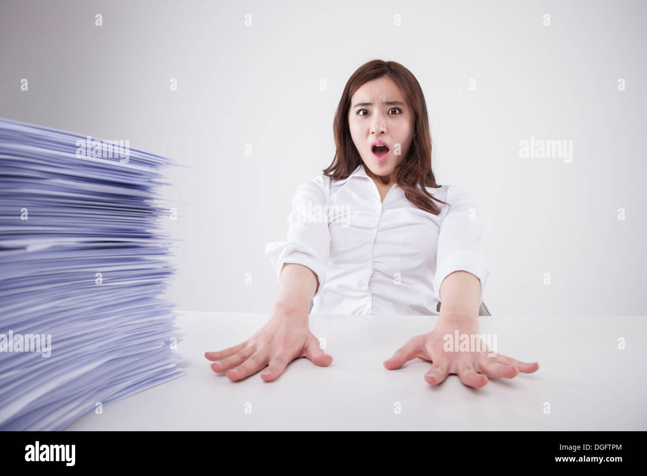a business woman with a big pile of work Stock Photo - Alamy