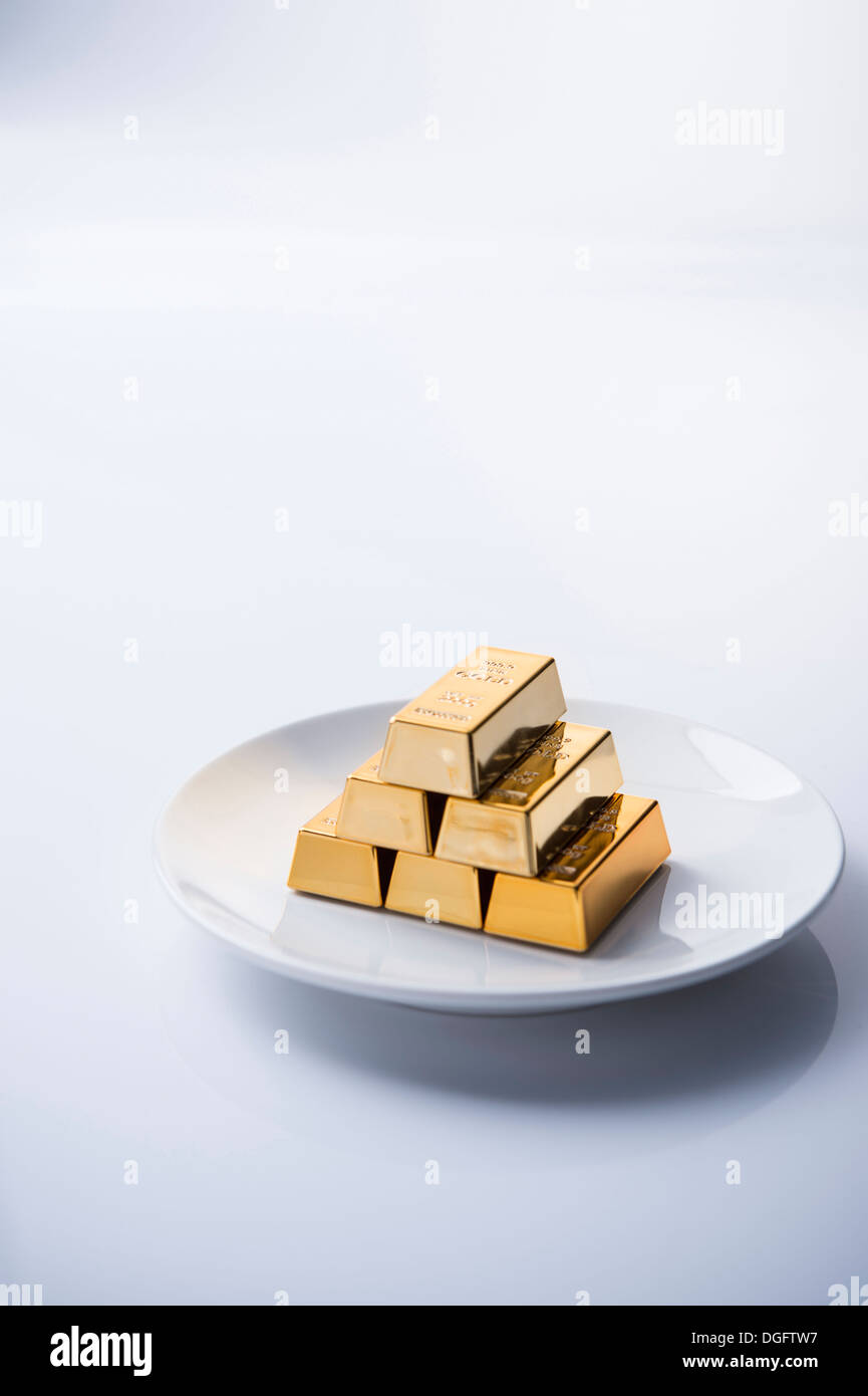 gold bars on a food plate Stock Photo - Alamy