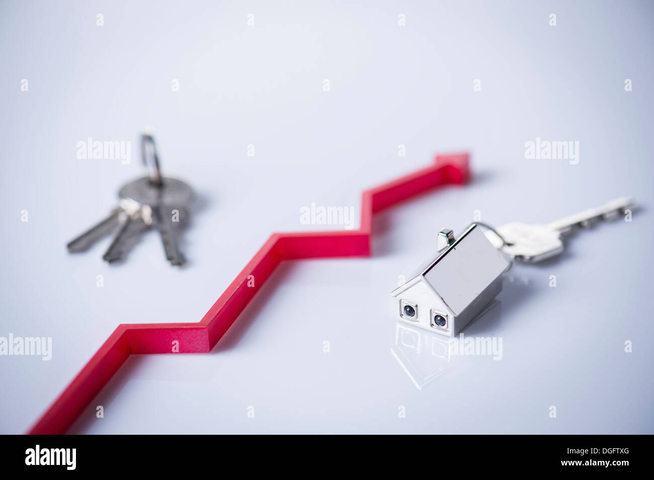two sets of keys next to a market line Stock Photo - Alamy