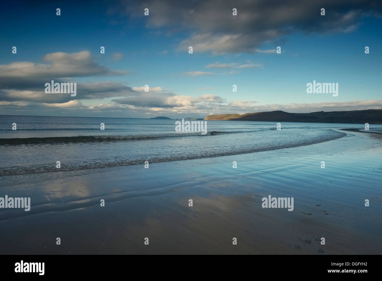 curves wavelets calm cold blue sky sea beach Stock Photo - Alamy