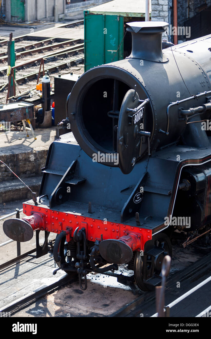 Steam tank locomotive sitting on turntable receiving inspection ...