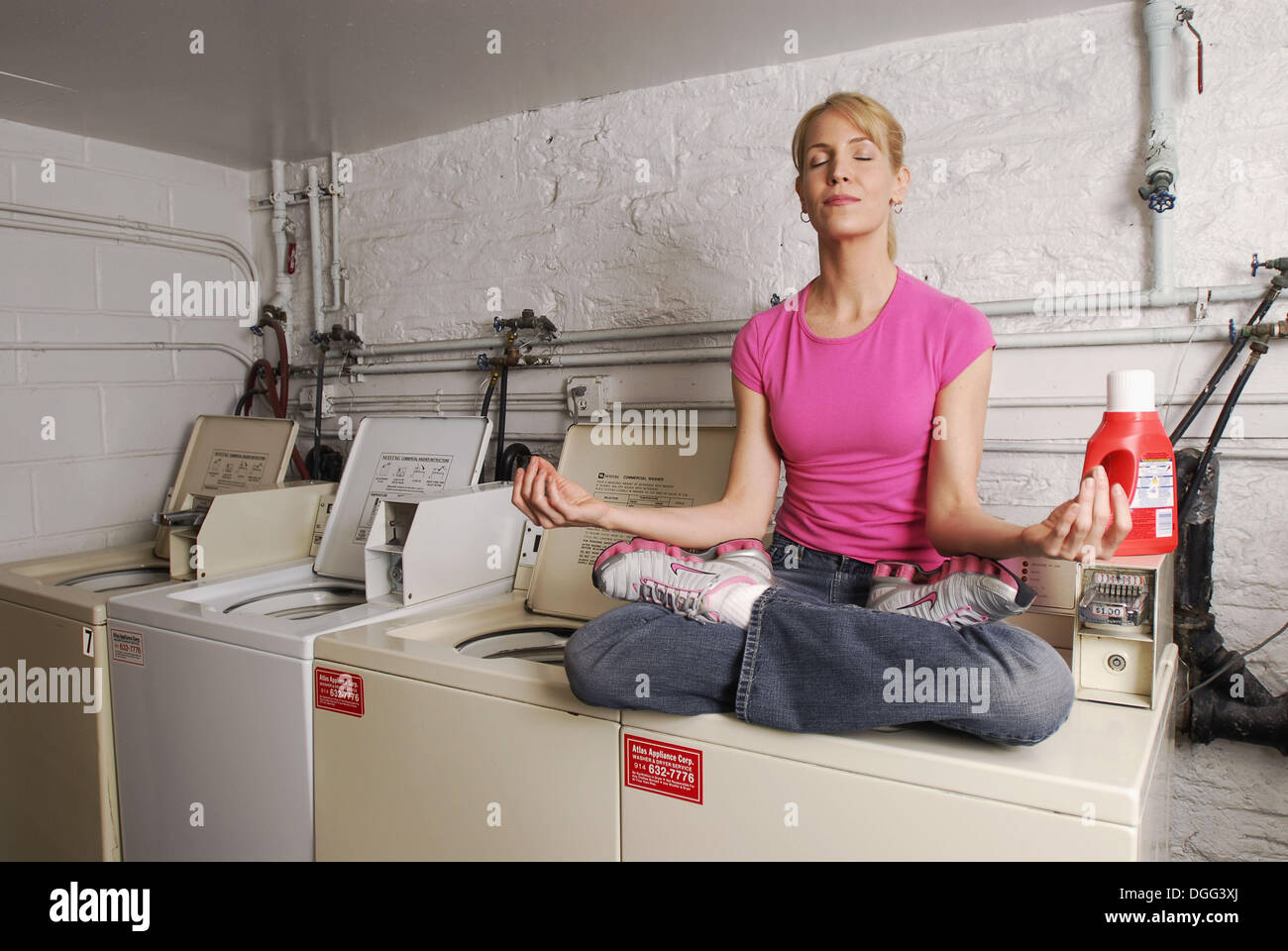 Woman washing machine cross hi-res stock photography and images - Alamy