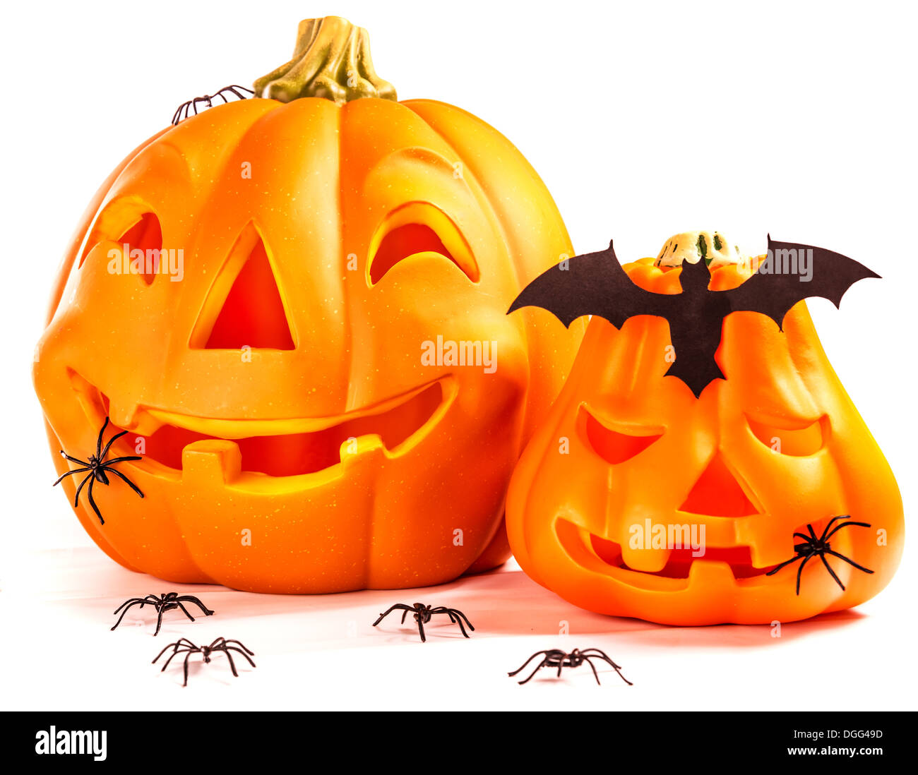 Carved Halloween pumpkins with many spiders and bat isolated on white ...