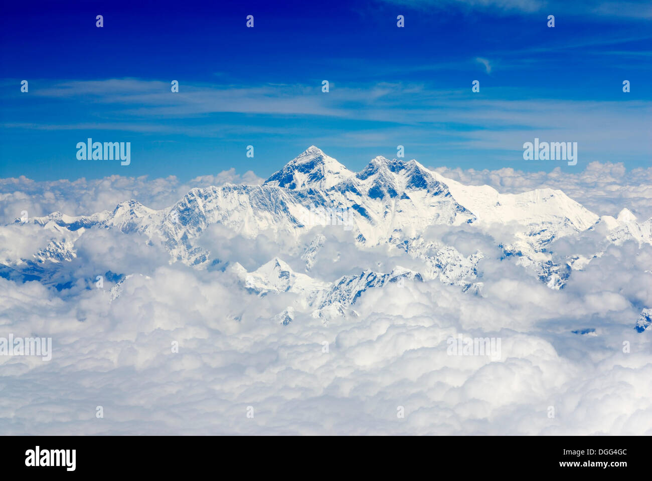 Snow-capped peaks of Mount Everest surrounded by clouds, the Himalayas ...