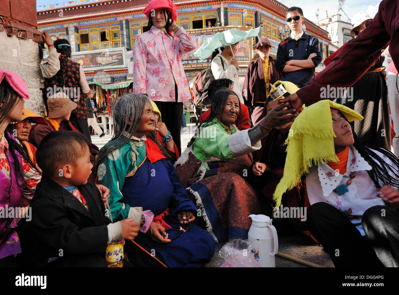 Tibetan pilgrims in front of Jokhang Temple, Lhasa, Tibet, China, Asia ...