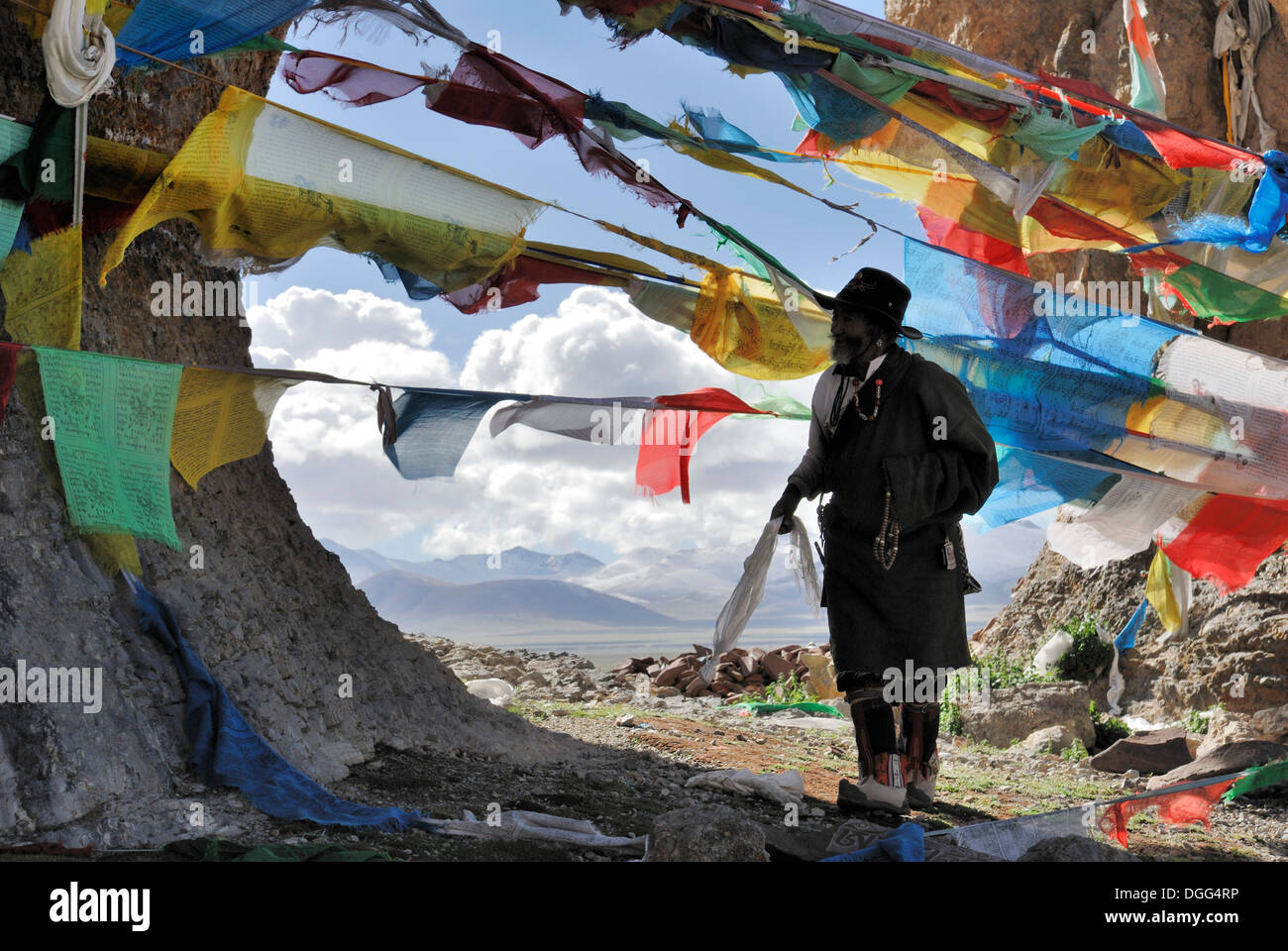 Tibetan pilgrims, prayer flags at the Sacred Stone, Namtso Lake ...