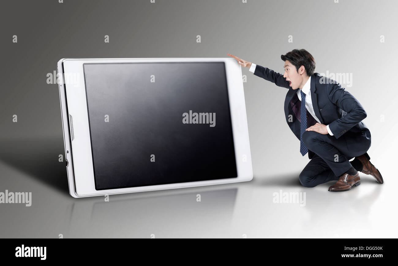 a tiny business man talking into a phone Stock Photo - Alamy