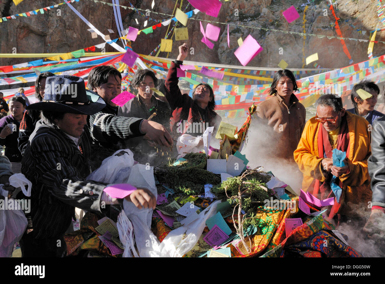 Offerings from Tibetan pilgrims at a ceremony at Namtso Lake, Heavenly ...