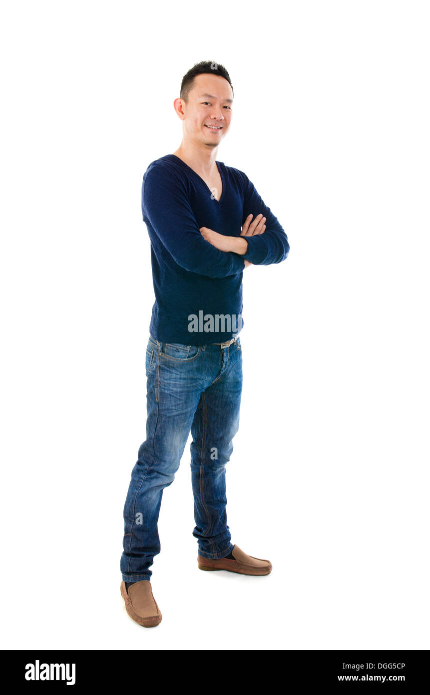 Asian man looking at camera against white background Stock Photo - Alamy