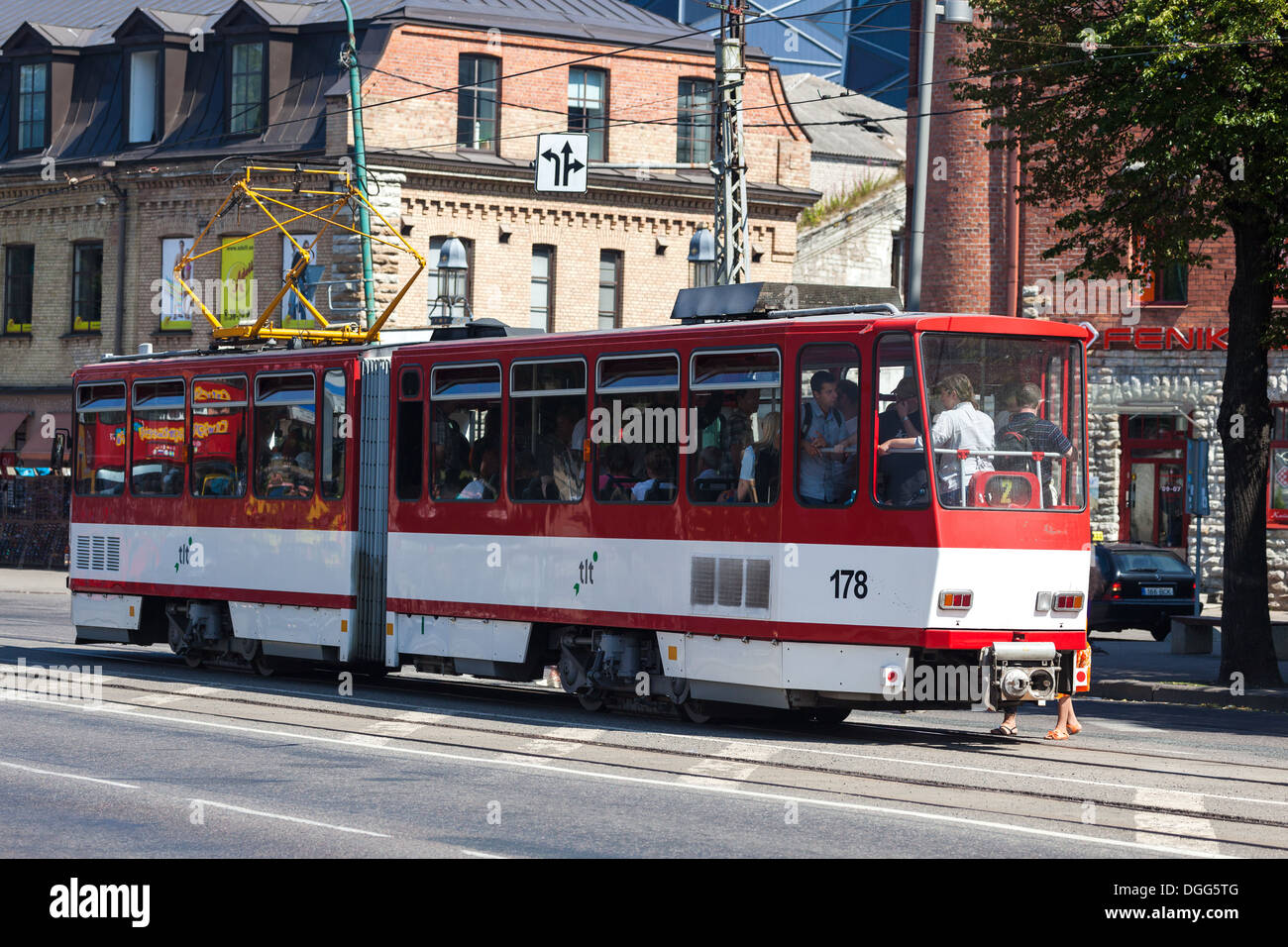 Passengers boarding busy city trams at intersection. Tallinn Estonia Stock Photo - Alamy