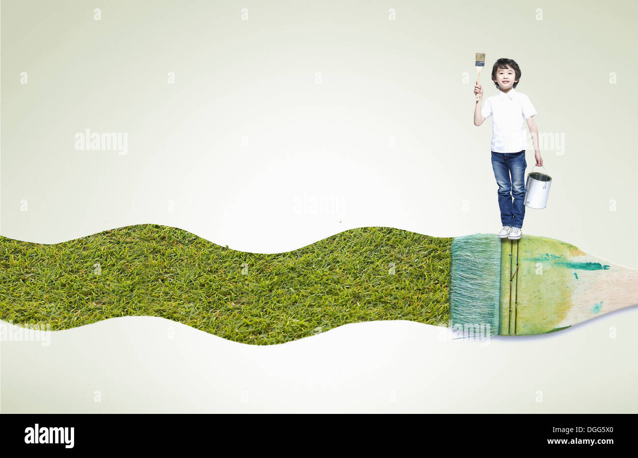 a boy standing on a paint brush Stock Photo - Alamy