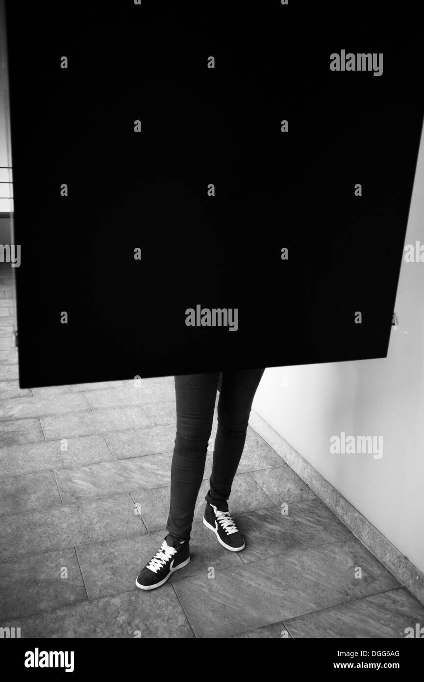 Visitor looking at a work of photographic exhibition Stock Photo - Alamy