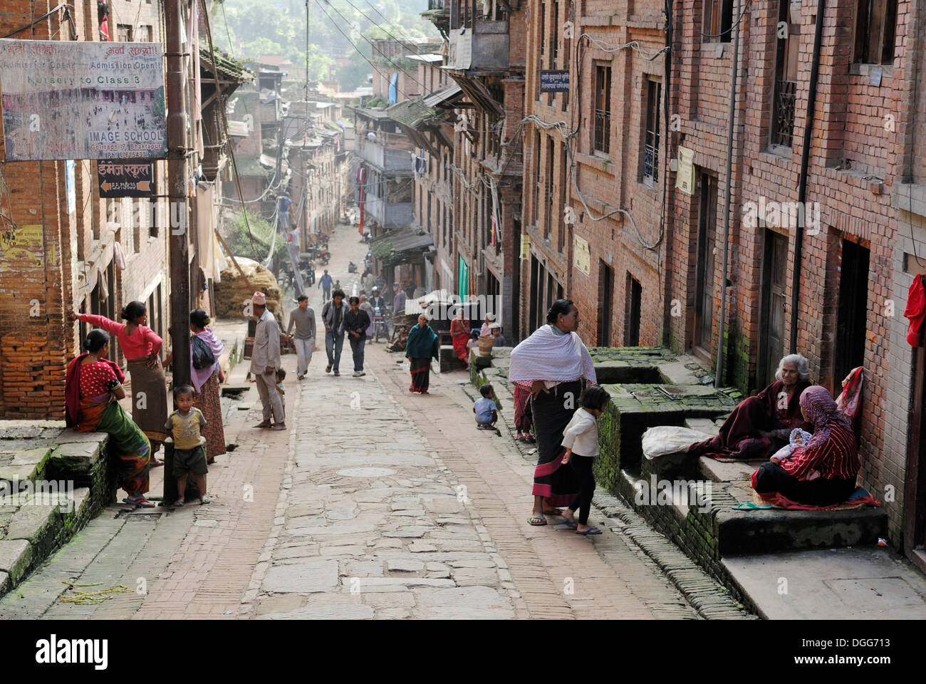 Nepalese people in traditional dress on historic street, Bhaktapur ...