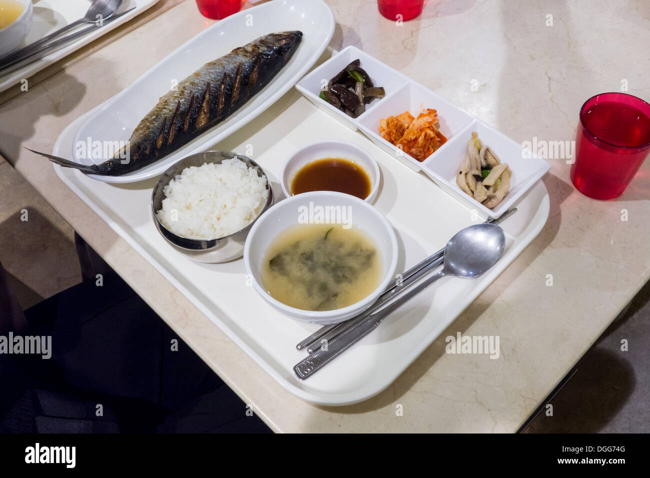 Typical self service simple menu (grilled fish, bowl of rice and soup ...