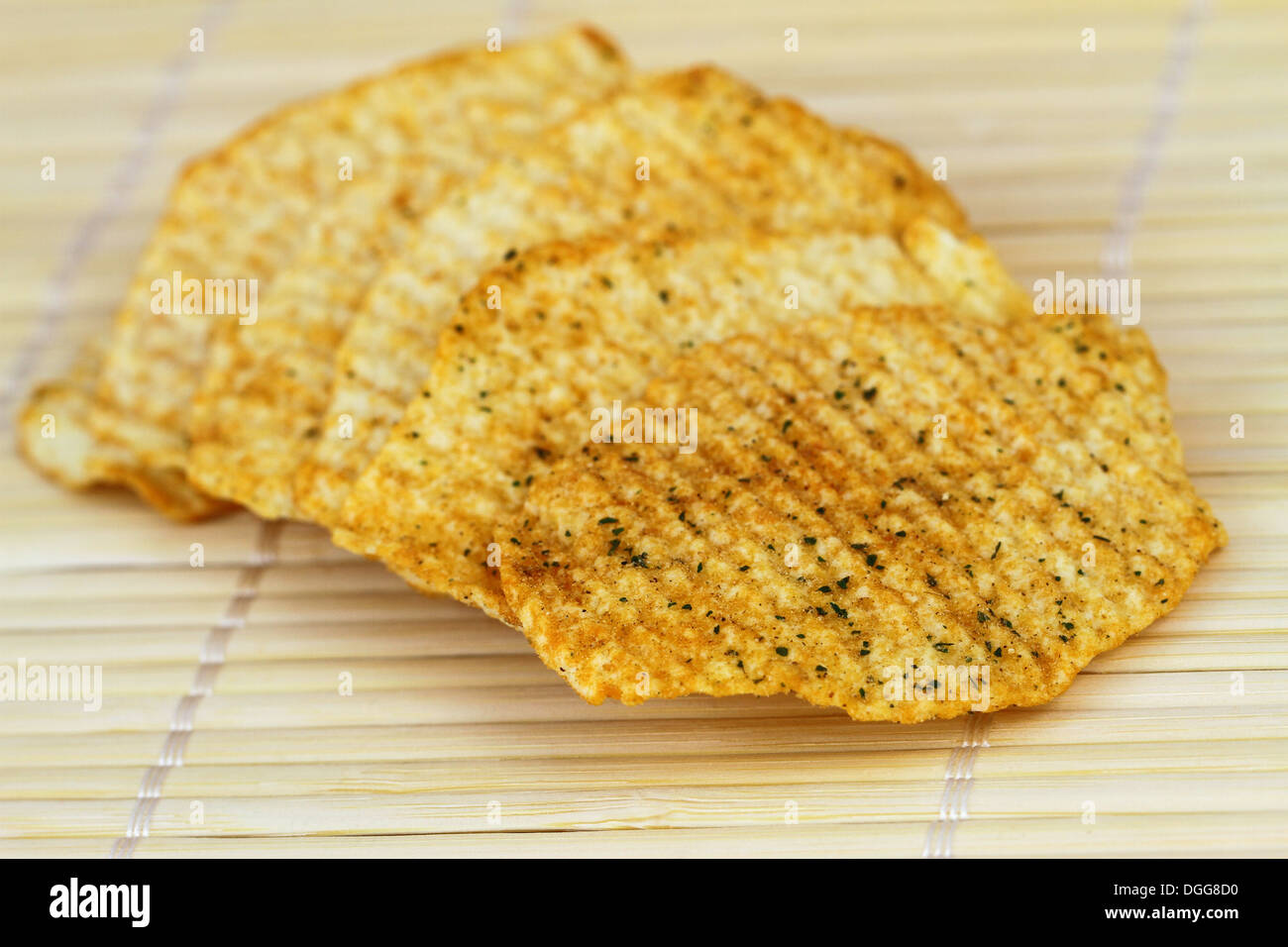 Baked potato crisps with Mediterranean herbs Stock Photo - Alamy