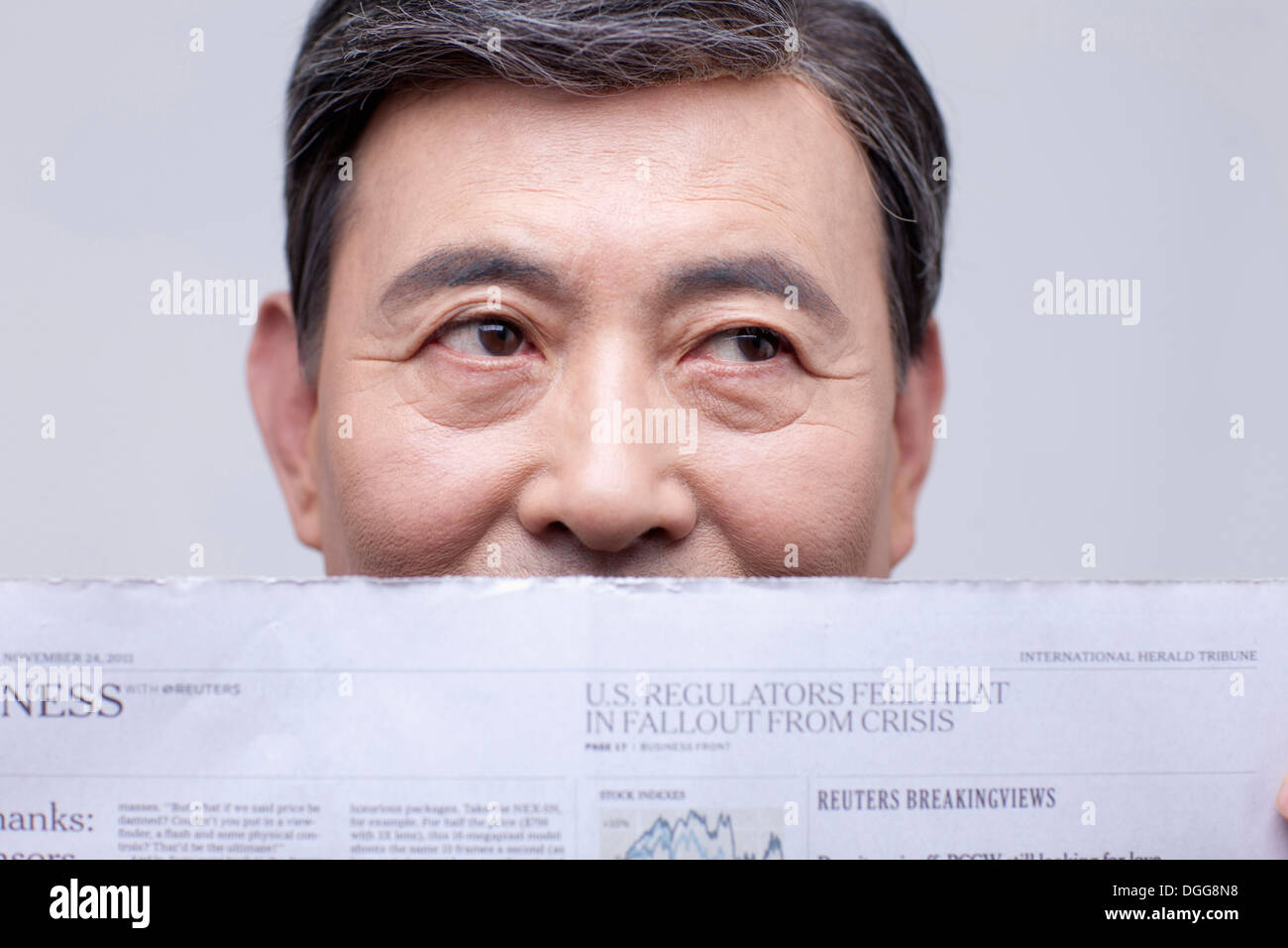 an old man reading a news paper Stock Photo - Alamy