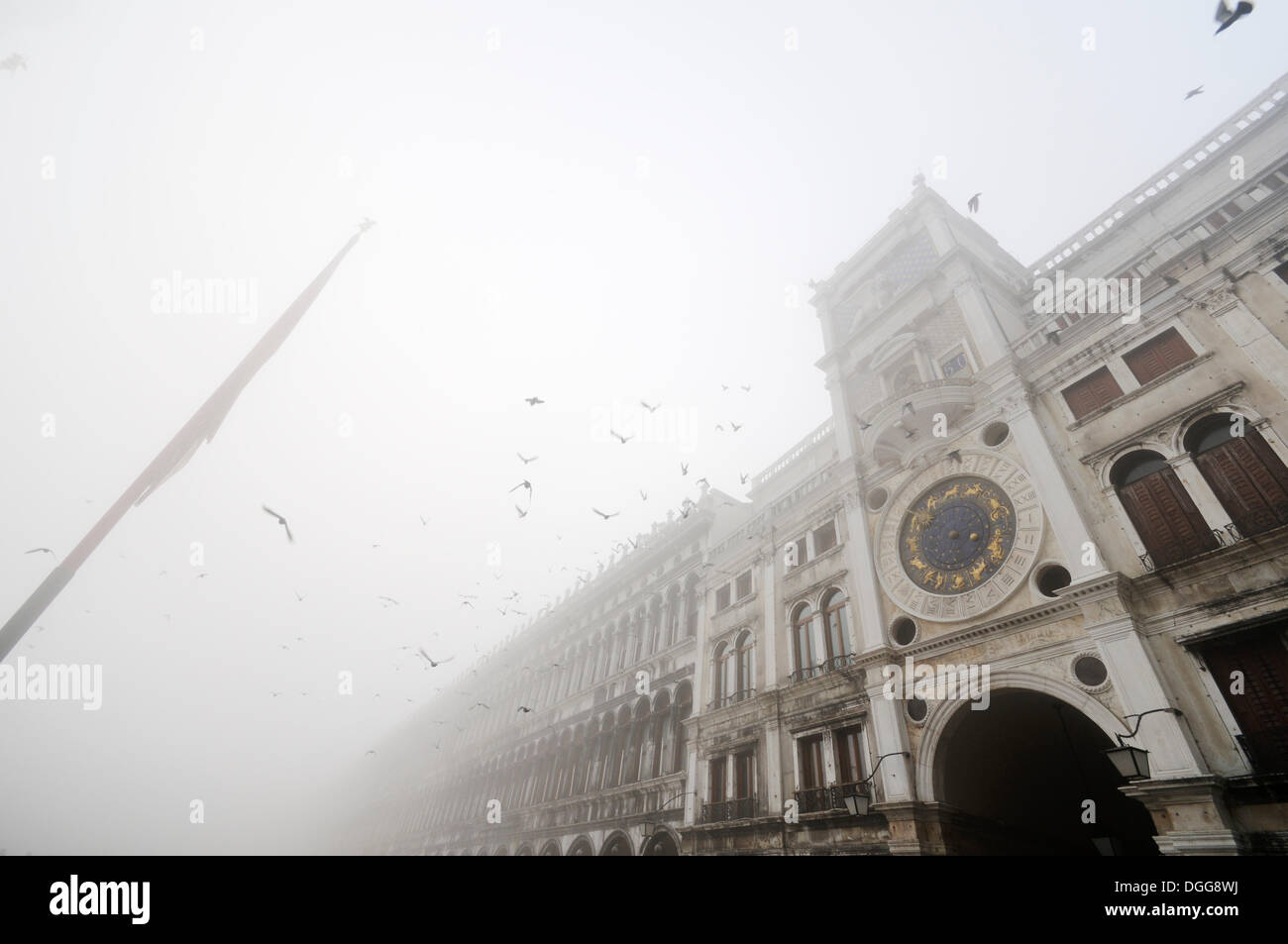 Procuratie building and Torre dell'orologio clock tower in the fog, St ...