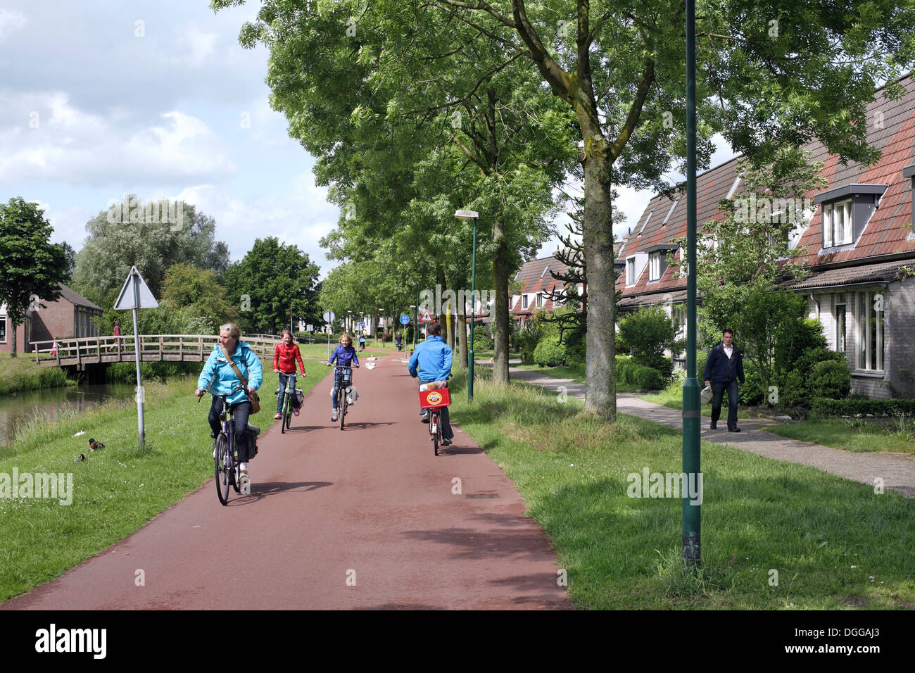 Cyclists on a cycle route in a residential area of Houten, a Dutch new ...
