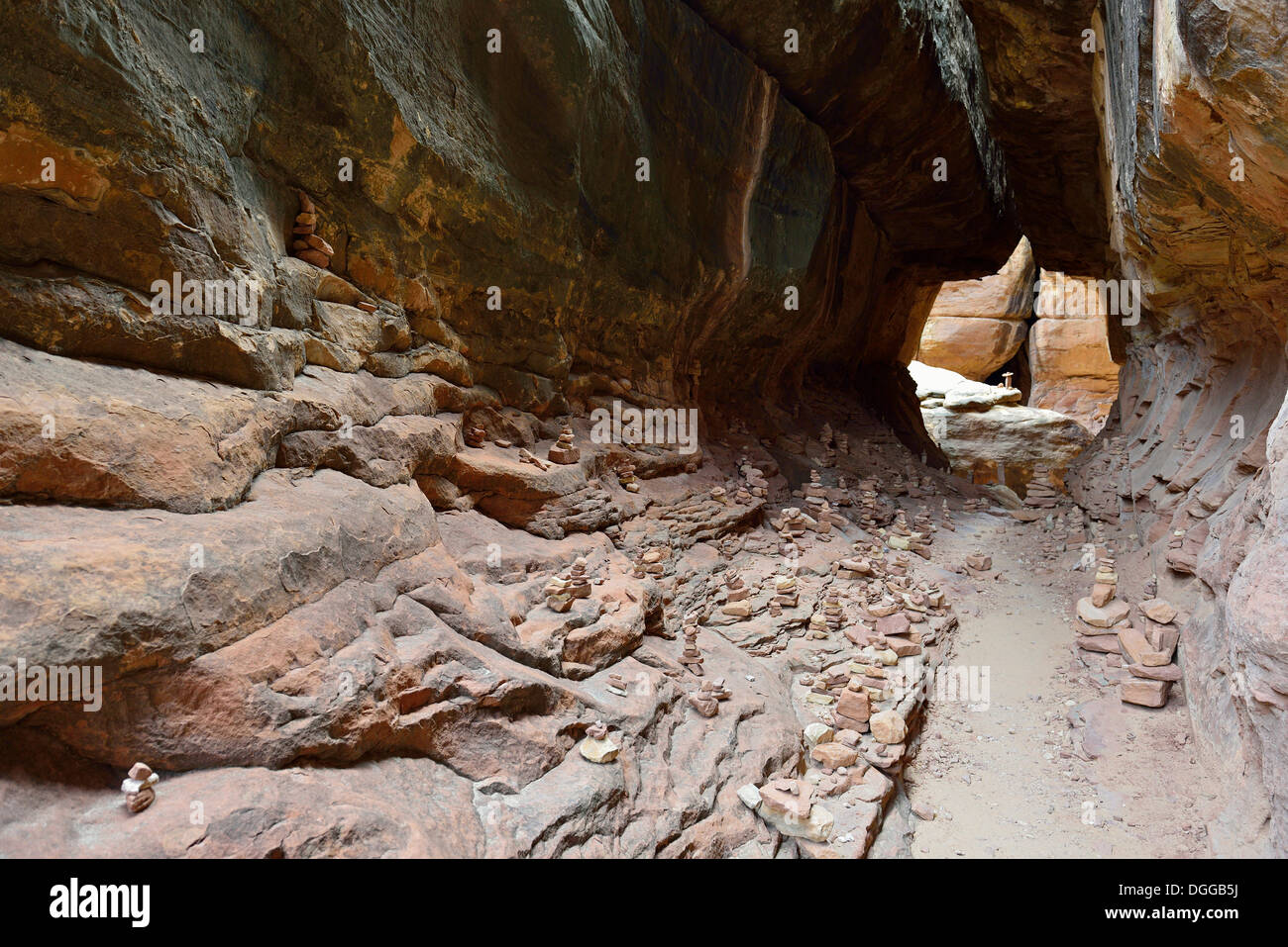 Rock cairns in the narrow canyon of Joint Trail, Canyonlands ...