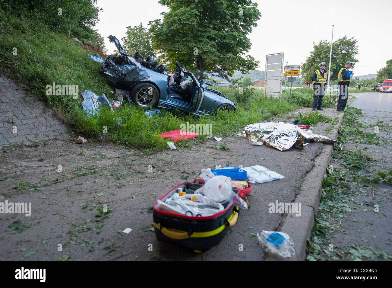 Rescue backpack in front of a destroyed car, fatal traffic accident on ...