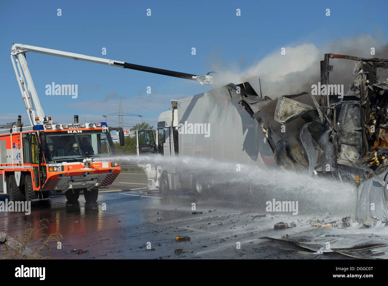 An airport fire engine is helping to extinguish at a truck fire on the ...