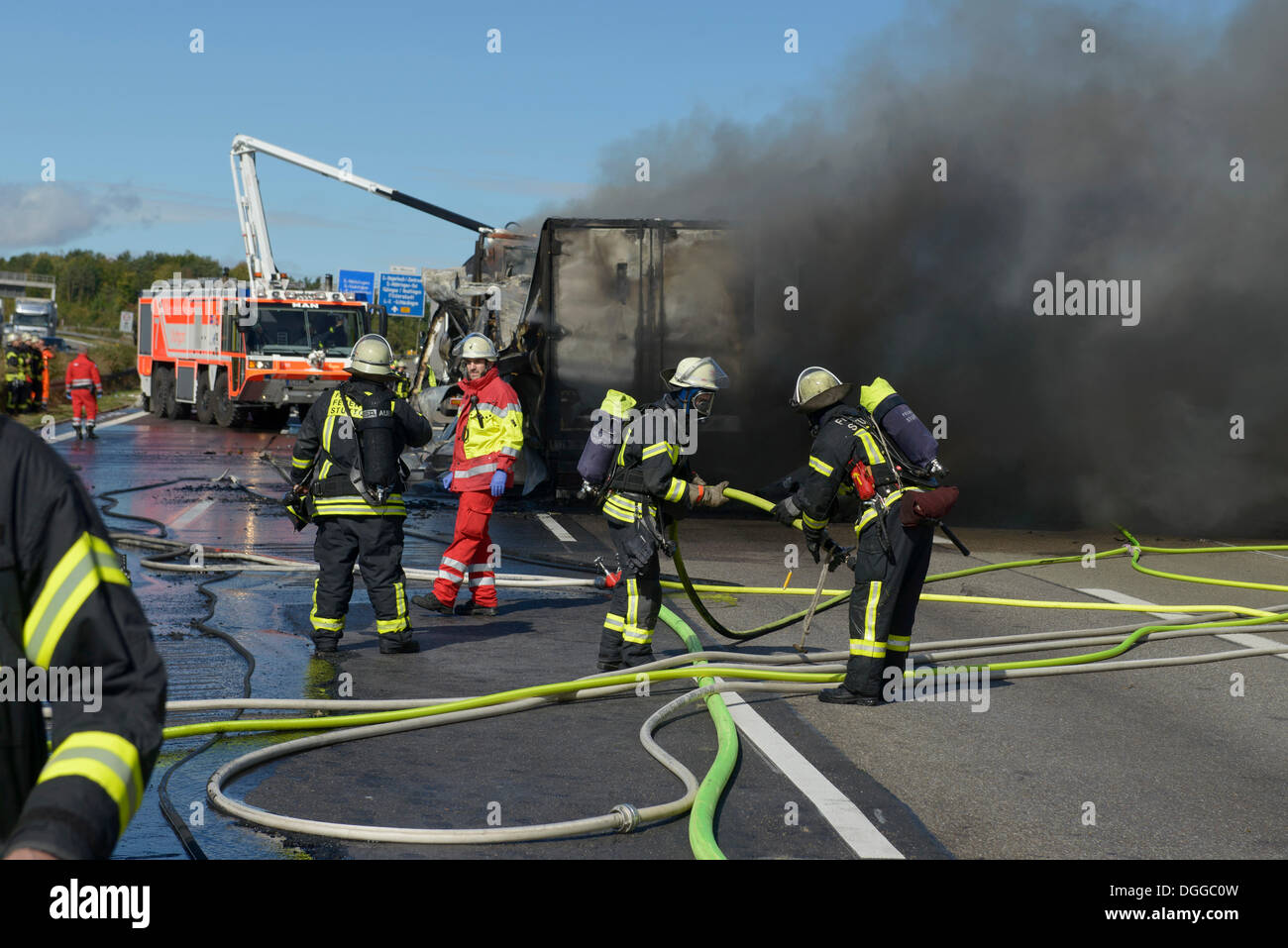 An airport fire engine is helping to extinguish at a truck fire on the ...