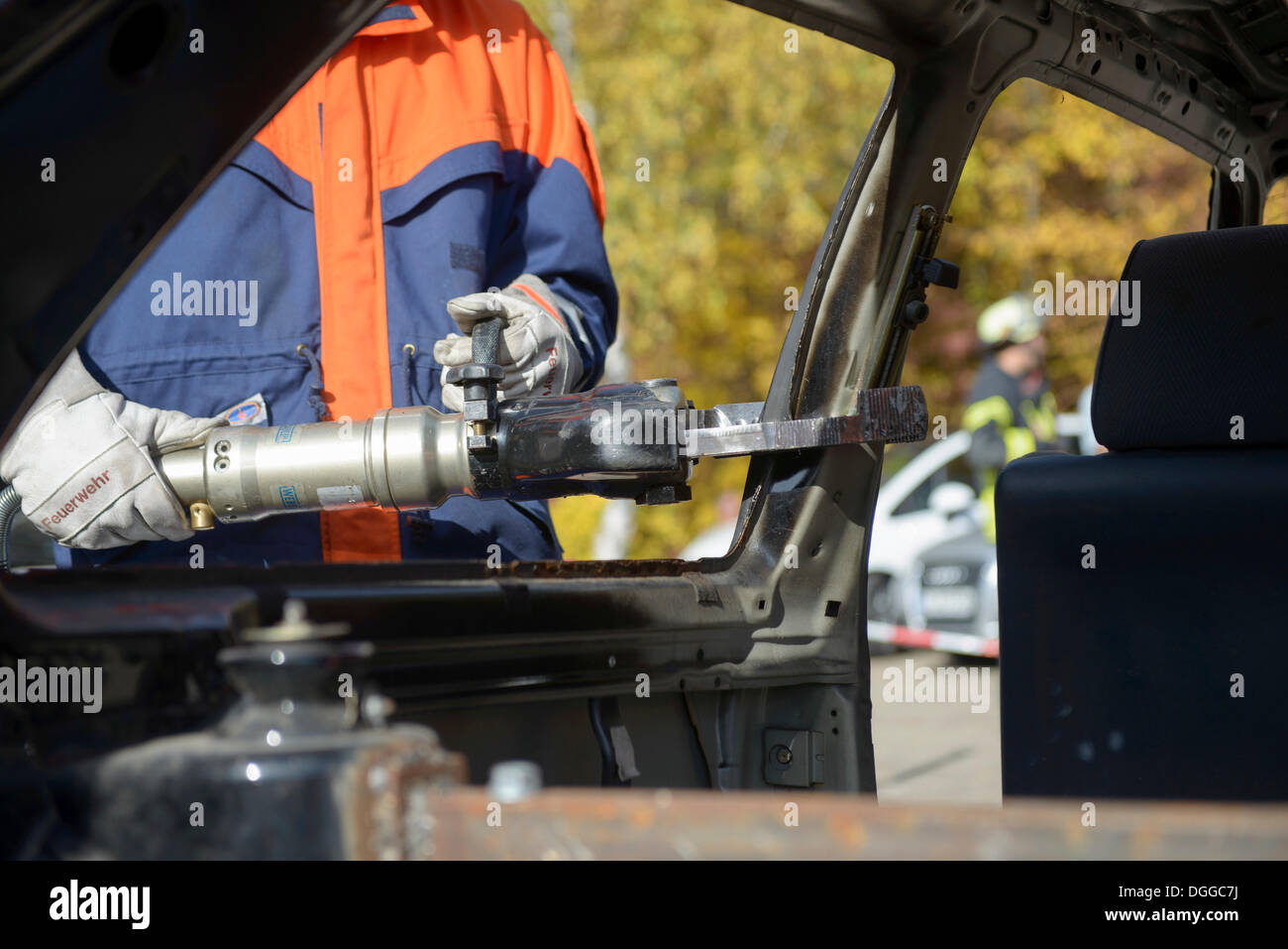 Firefighter working with hydraulic rescue equipment, final fire service ...