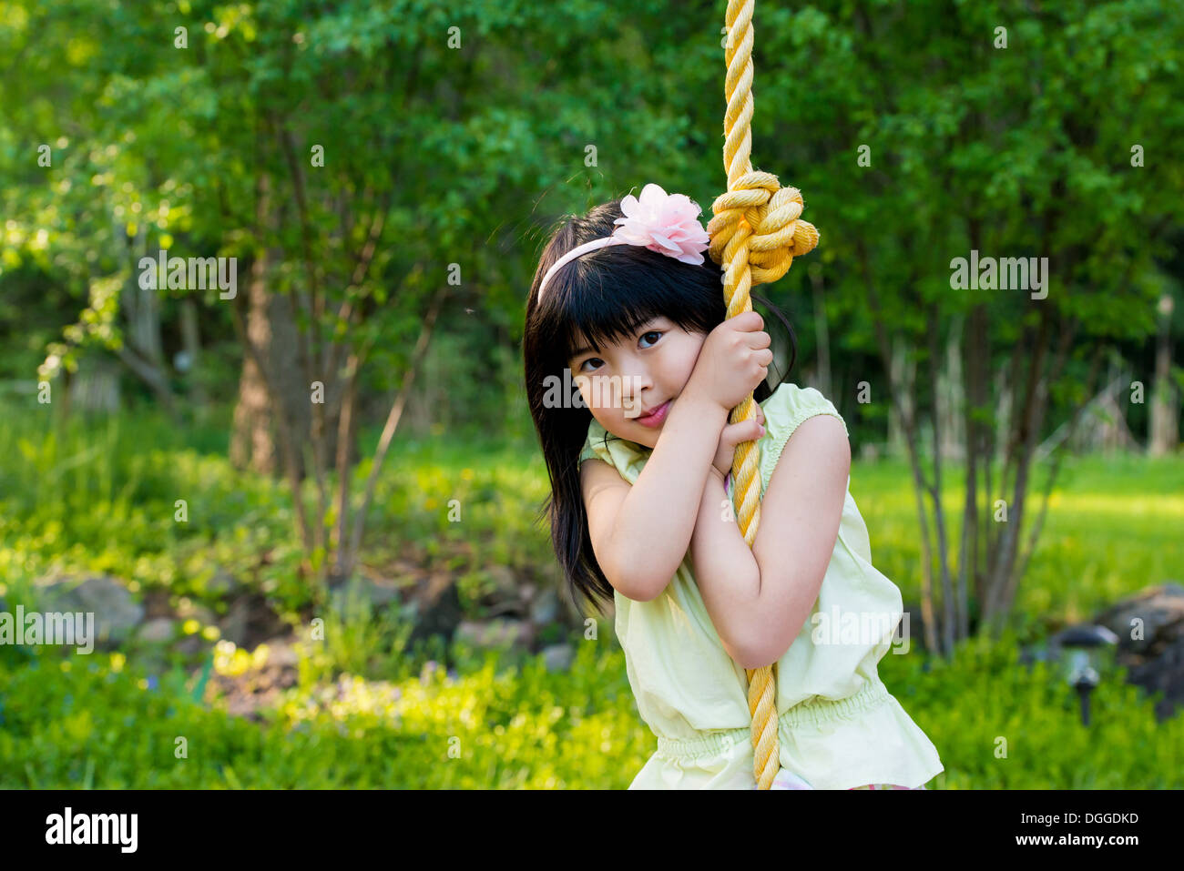 Girl on swing rope hi-res stock photography and images - Alamy