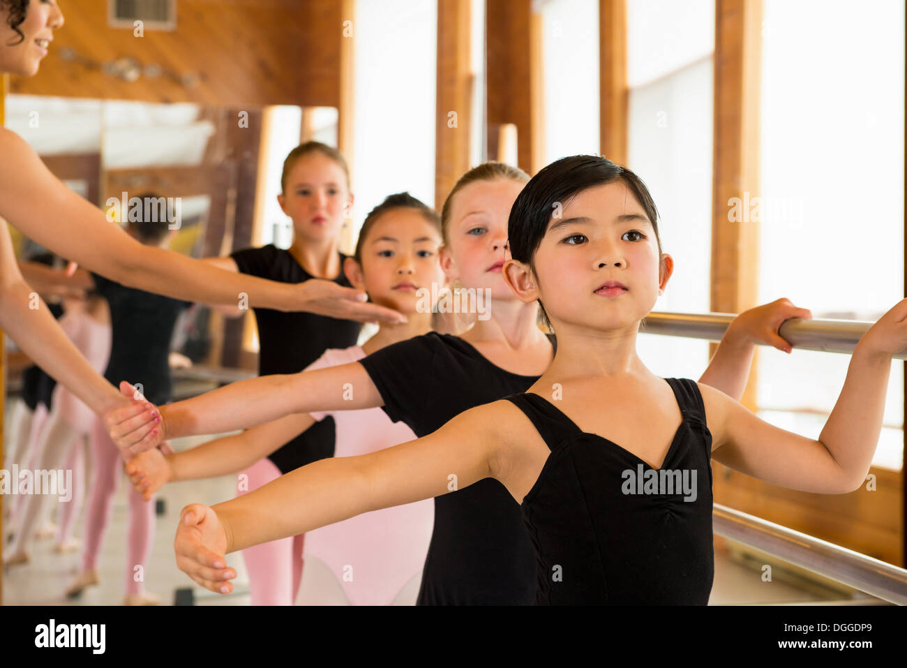 Ballerinas practising at the barre in ballet school Stock Photo - Alamy